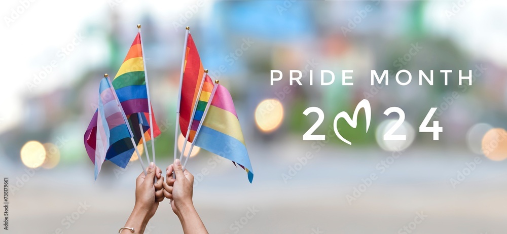 Happy Pride Month 2024 on rainbow flags raising background, concept for ...