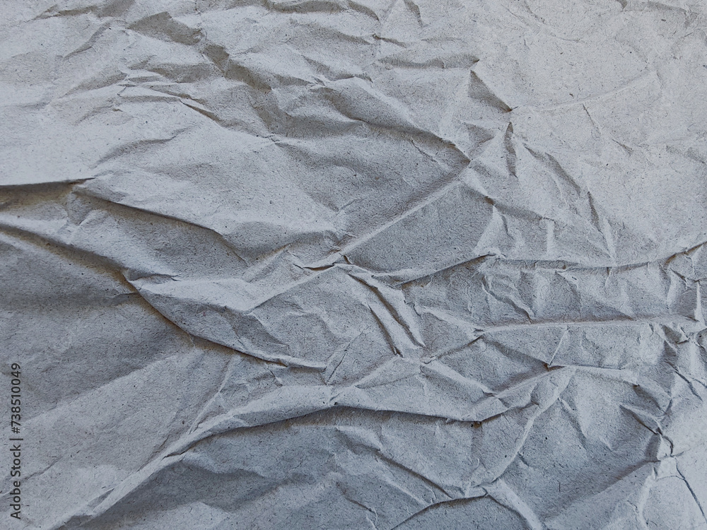 wrinkled light gray newsprint paper(packing paper) background. Textured ...