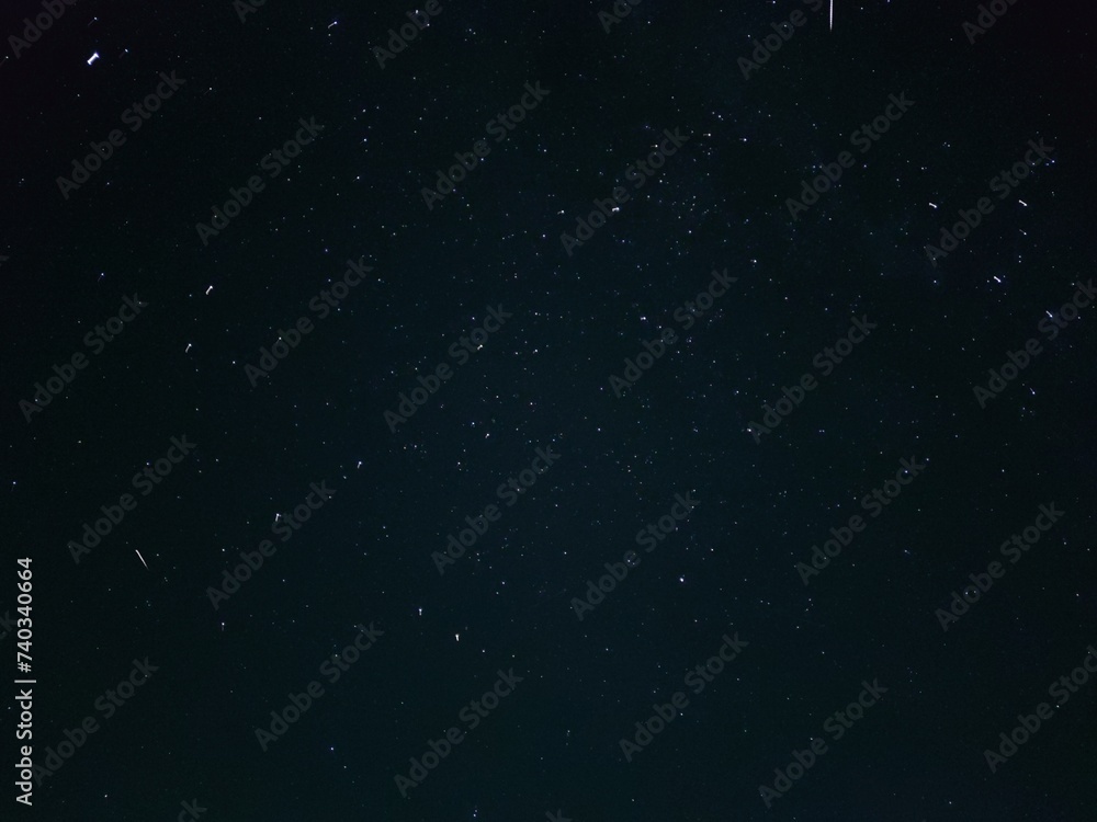 Stock-Foto „Starry night sky in village. A black-gray night sky in ...