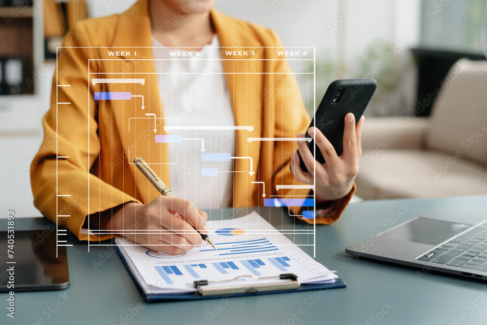 Project manager working and update tasks with milestones progress ...