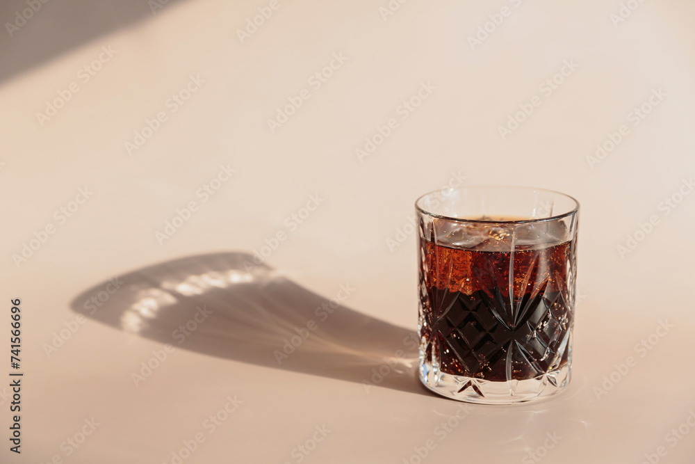 Whiskey cola cocktail with strong alcohol and ice in highball glass on ...