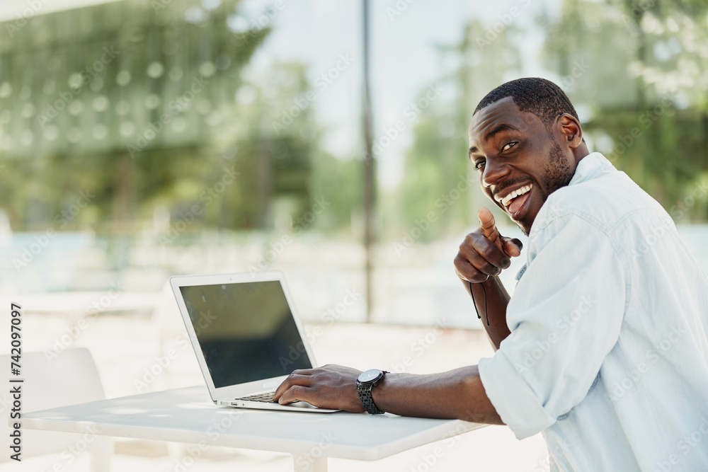 Sitting businessman young computer adult technology working male laptop ...