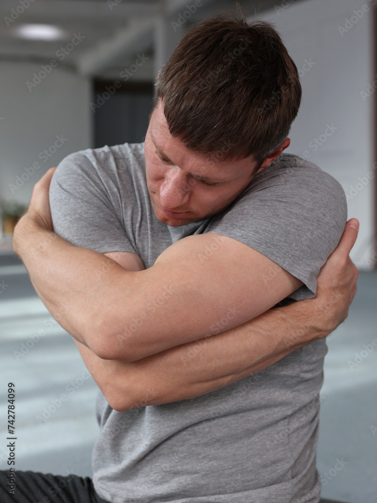 Man hugging herself, self-love, self-acceptance concept. somatic ...