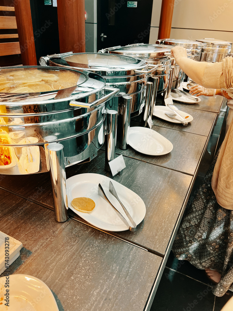 Lined up in the hotel buffet are several machines dedicated to keeping ...