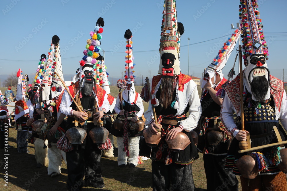 People called Kukeri parade in masks and ritual costumes, perform ...