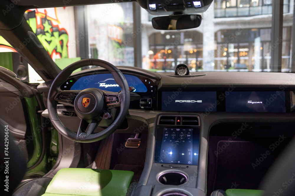 closeup steering wheel, Interior, cockpit of Porsche Taycan Turbo S ...