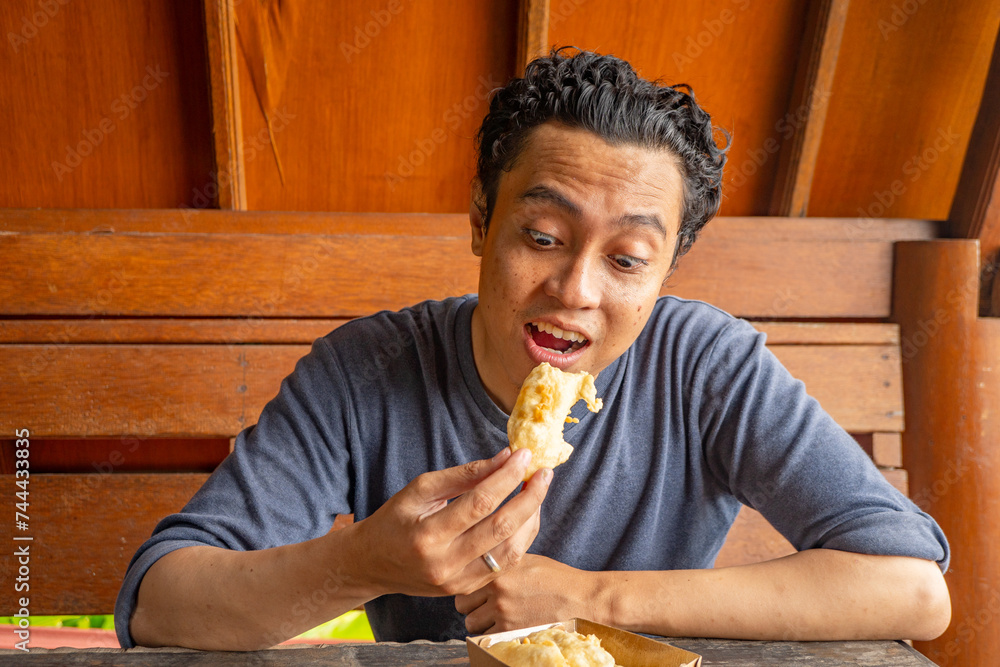 Man expression happy smile surprised when eat the banana fries The ...
