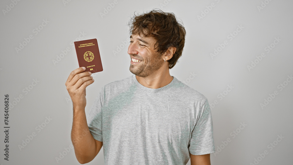 Confident young blond man, a happy greek patriot, smiling with joy as ...