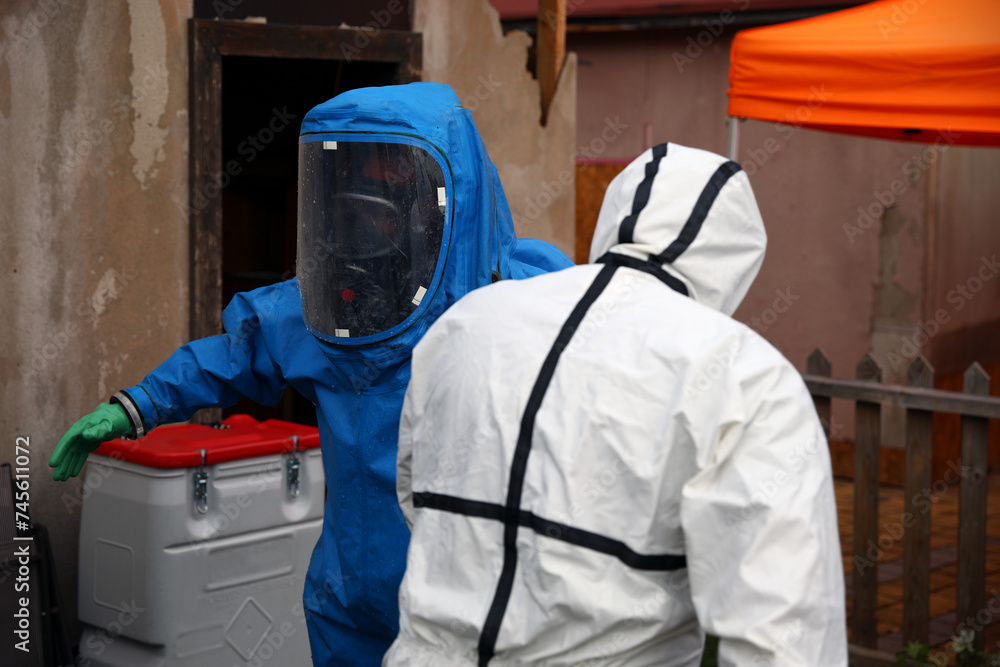 People wear Personal protective equipment (PPE) with gas mask for ...