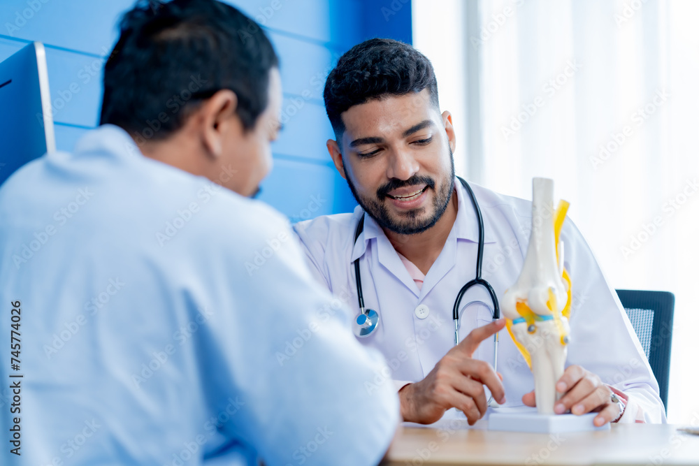Asian male orthopedics professional doctor consulting explaining knee ...