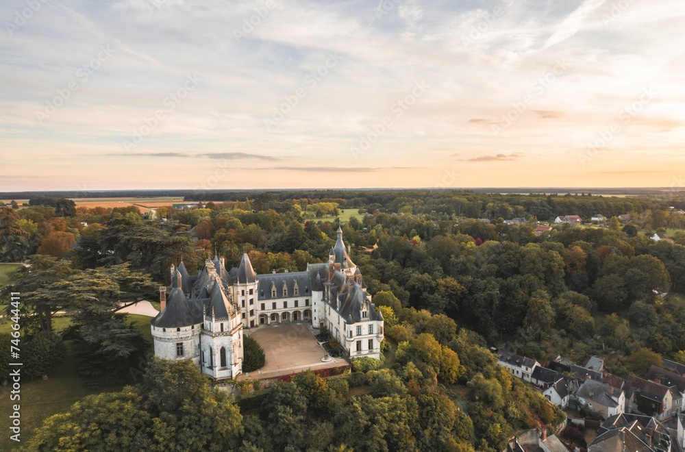 A breathtaking aerial perspective reveals a grand castle nestled amidst ...