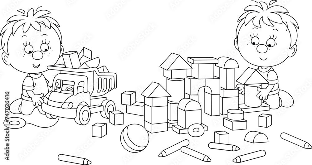 Happy little boys playing with a toy truck and bricks and building a ...