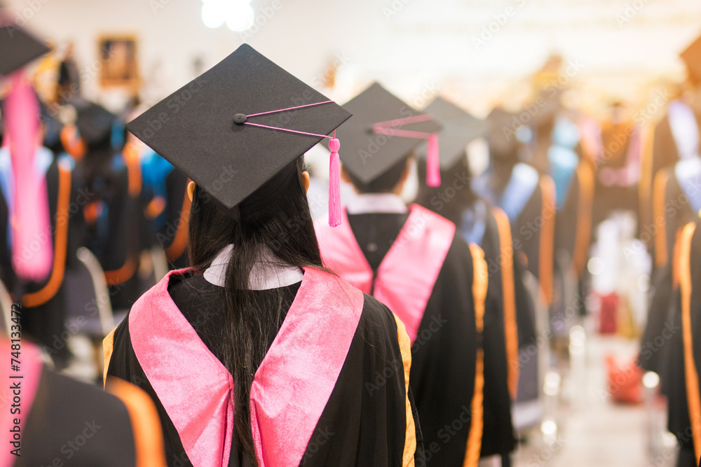 Graduation Ceremony with Students in Cap and Gown. Back view of ...