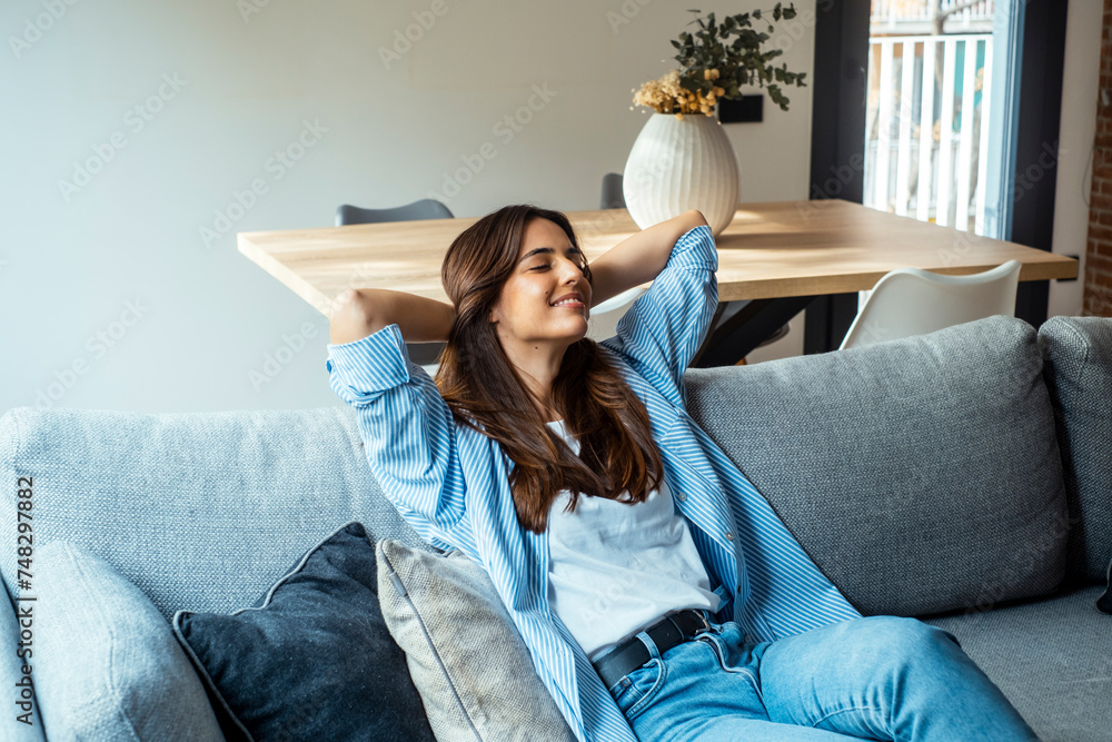 Kick back and relax concept. Young beautiful brunette woman with ...