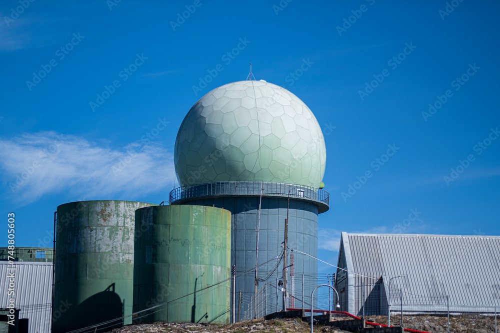 Milky way galaxy over observatory, with astronomers peering through ...
