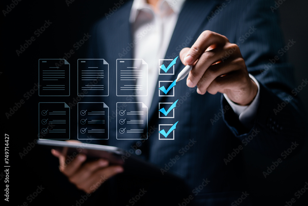 Businessman use tablet to paperless online approval for document ...