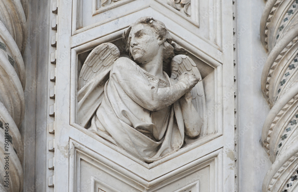 Angel in white marble, detail on the front gable from the Cattedrale di ...