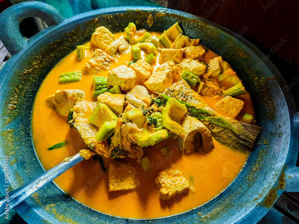 Sea fish curry or known as Gulai Ikan and a mixture of tempeh and ...