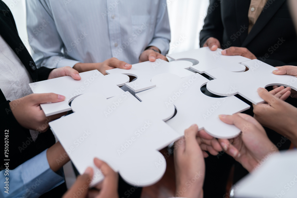 Diverse corporate officer workers collaborate in office, connecting ...