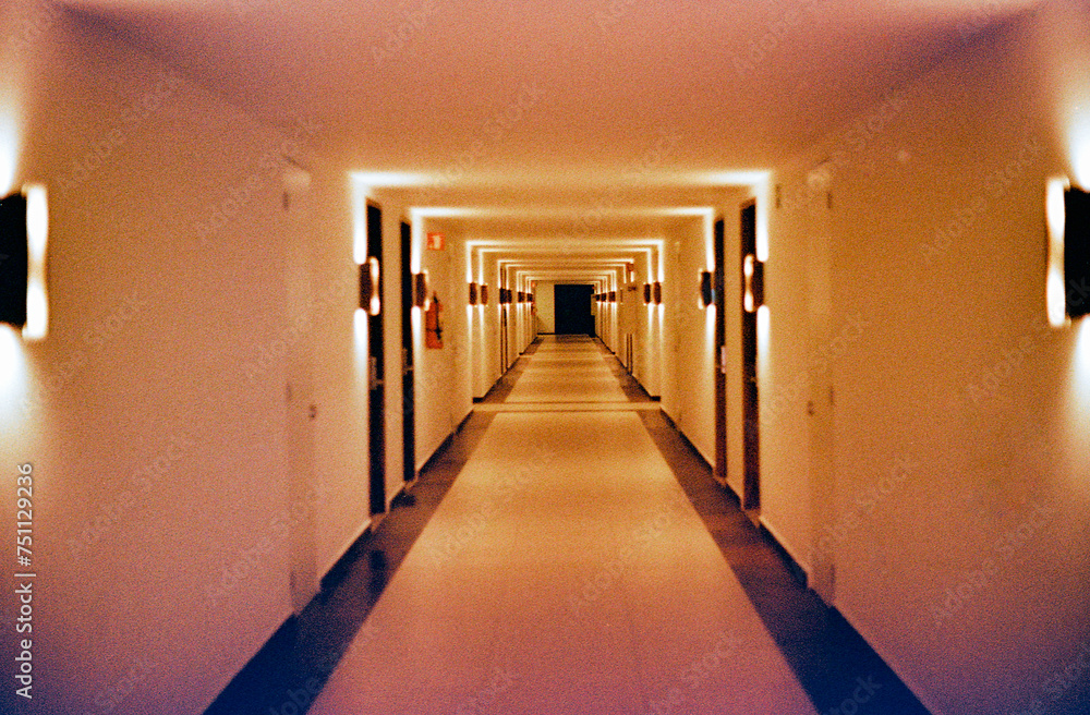 Empty Hotel Corridor At Night, Illuminated By Recessed Wall Lamps Stock ...