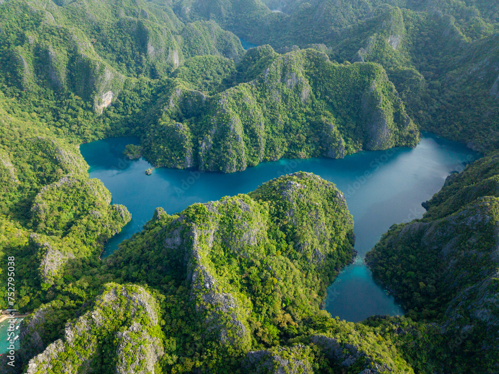 Tropical landscape of mountain lake with limestone rocks. Kayangan Lake ...