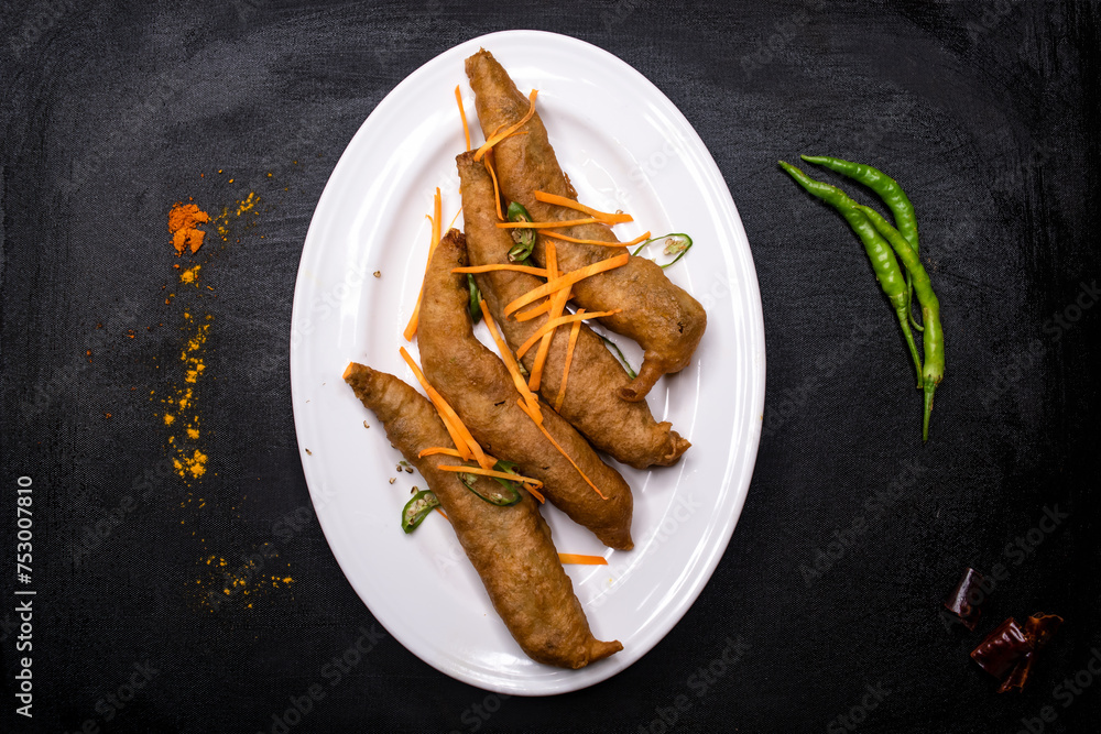 Loitta Fry Fish served in dish isolated on dark background top view ...