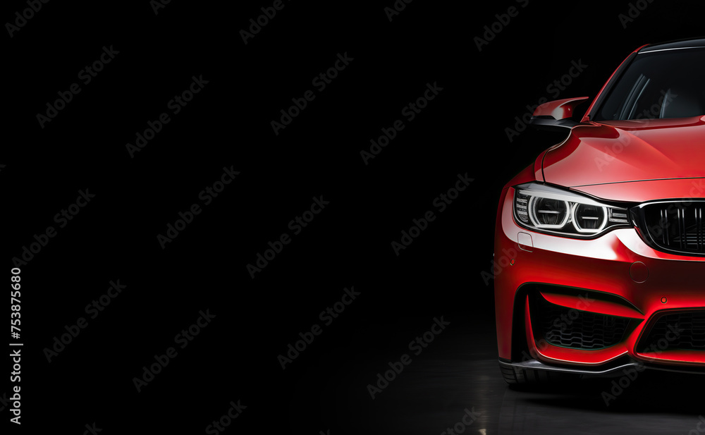 Generic and unbranded red luxury car isolated on a black background ...