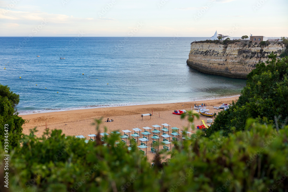 Picturesque view of beach and cliff of Our Lady of the Rock (Praia de ...