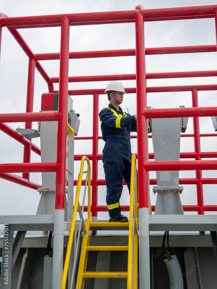 Seaman crew member of cargo vessel equipped with personal protective ...