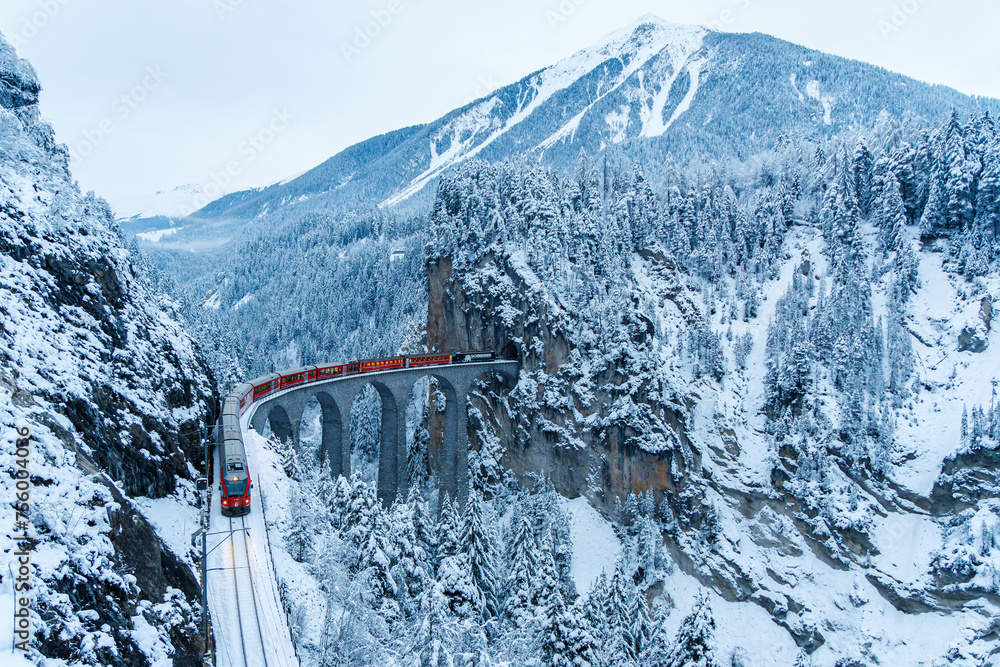 Rhaetian Railway passenger train at the famous Landwasser Viaduct on ...