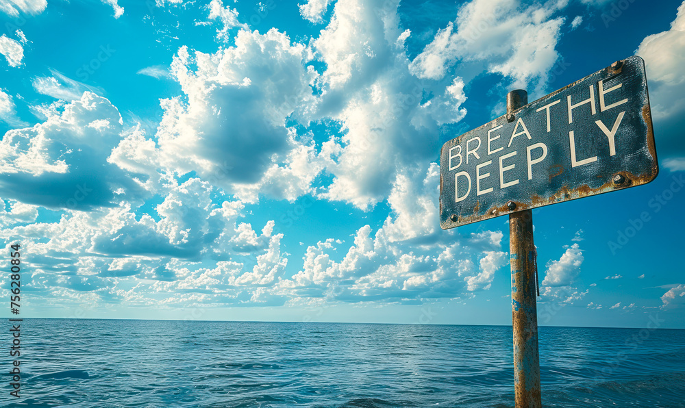 Inspirational black sign against a cloudy sky with BREATHE DEEPLY in ...