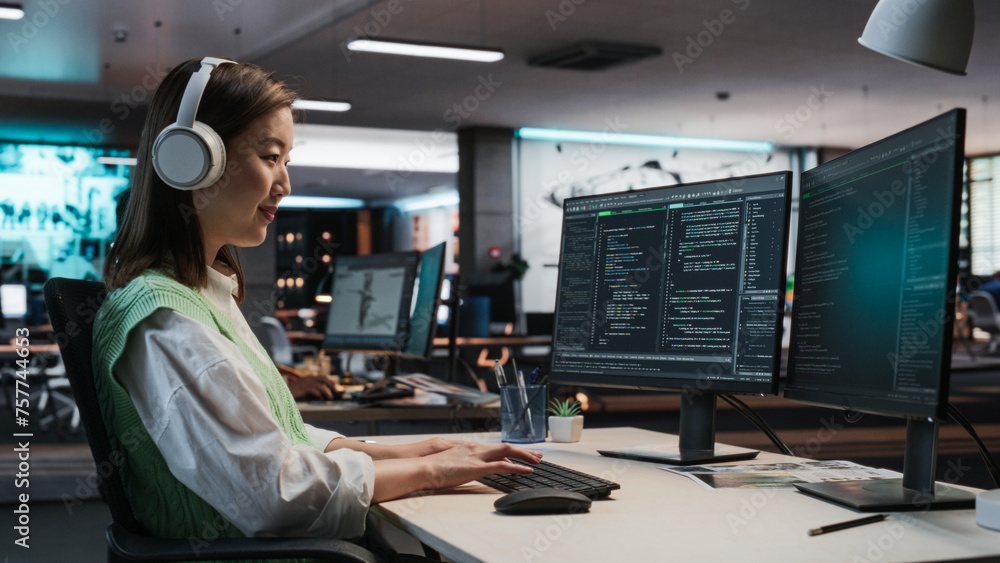 Female Asian Game Programmer Coding On Desktop Computer In Game ...