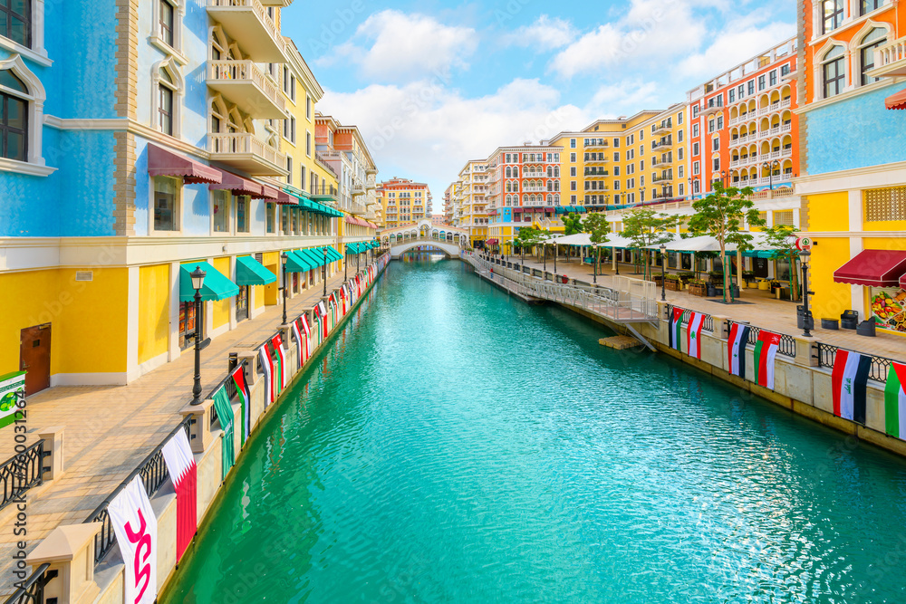 Colorful waterfront shops, cafes and residential apartments along the ...