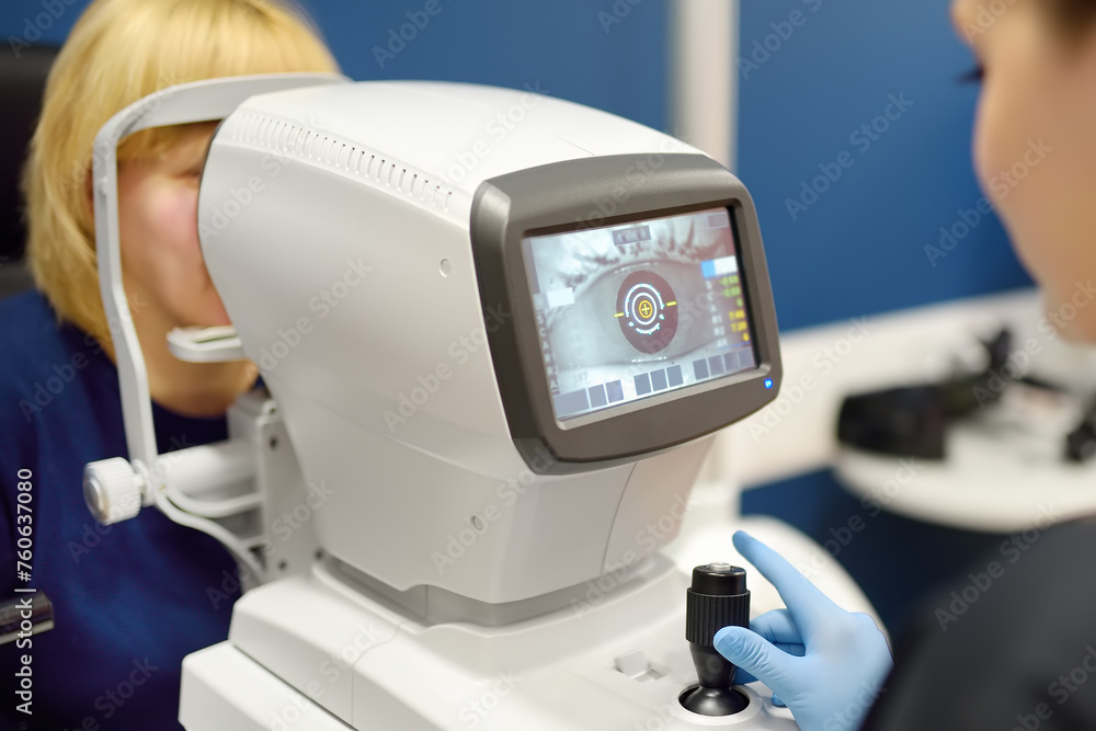 Patient during visit to optometrist for microscopic analysis of eyelids ...