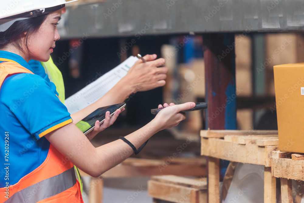 Warehouse management team check stock inventory. Asian men women worker ...