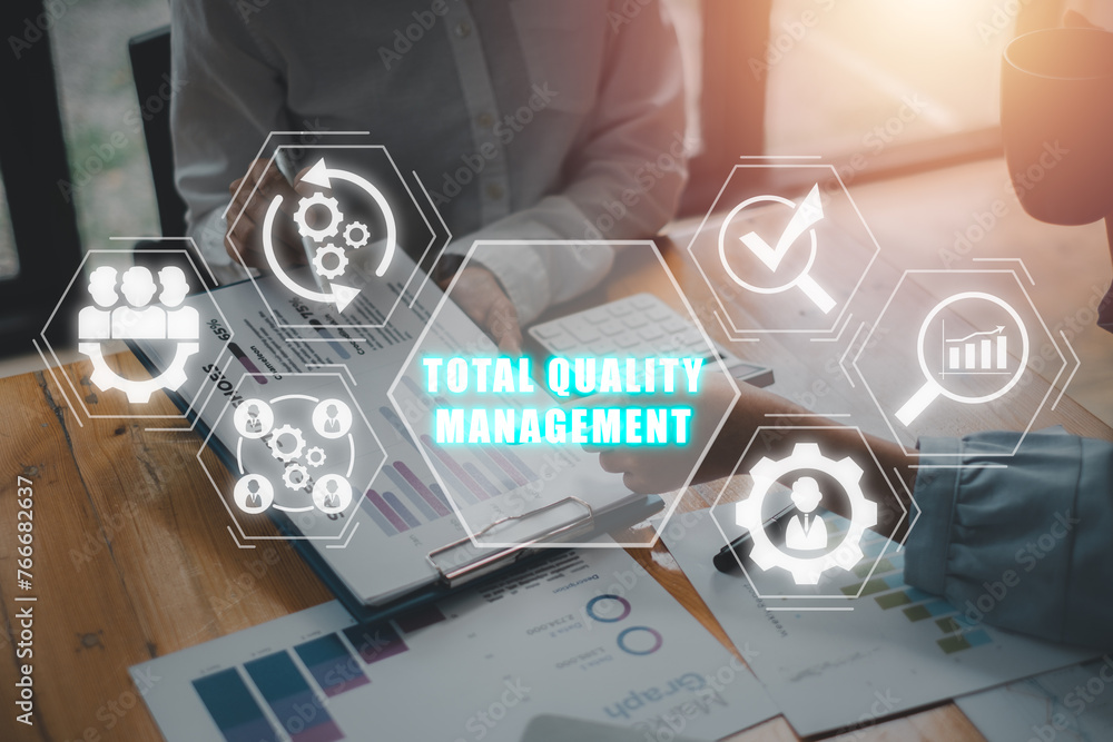 Total quality management concept, Business team analyzing income charts ...