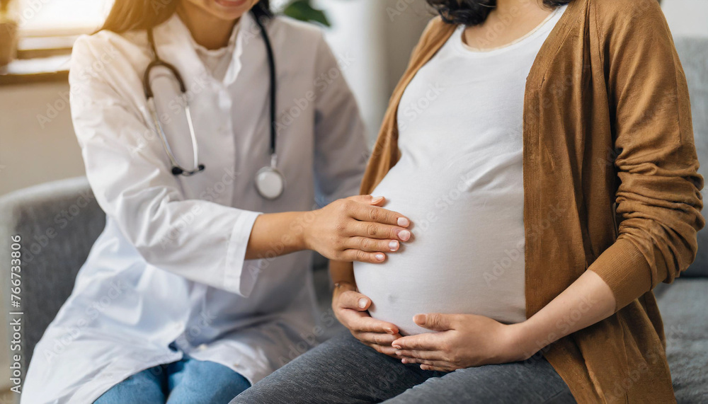 Obstetrician's hand tenderly touches pregnant belly at home visit ...