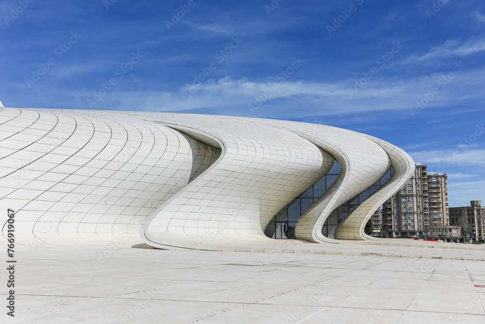 Sweeping Curves and Reflective Glass Facade of Heydar Aliyev Center by ...