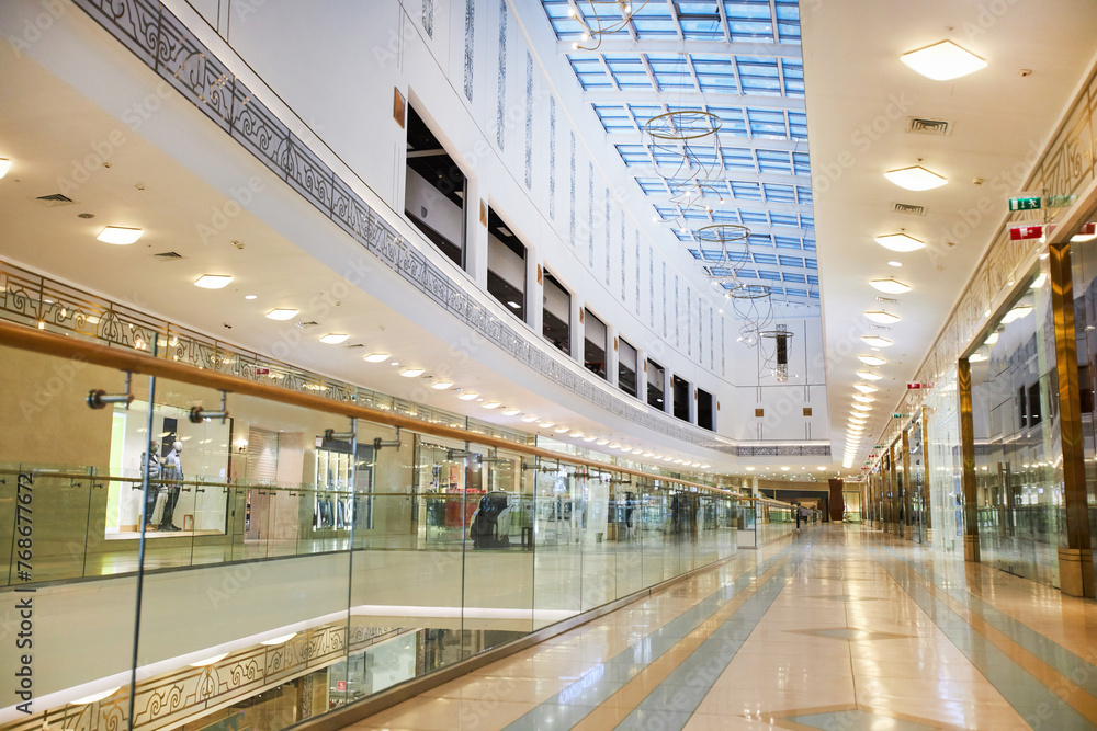Wide angle background image of multi storey shopping mall interior with ...