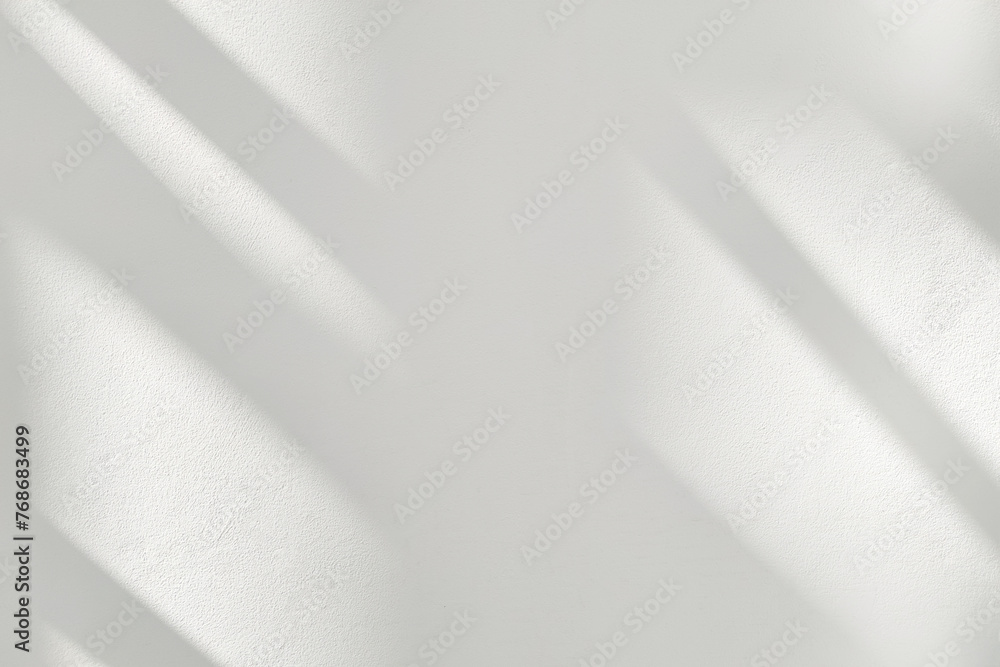 Abstract light reflection and grey shadow from window on white wall ...