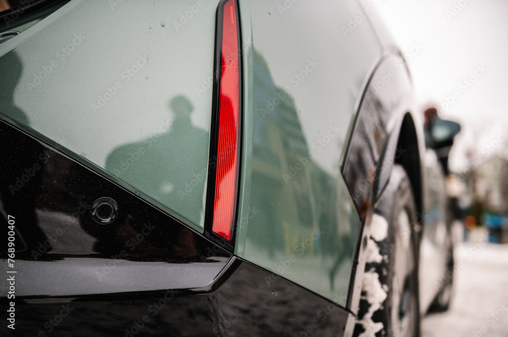 Parktronic on rear bumper, wheel. Parking sensor closeup. Right rear ...