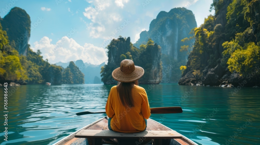 Adventurous woman exploring mysterious waters on boat in southeast asia ...