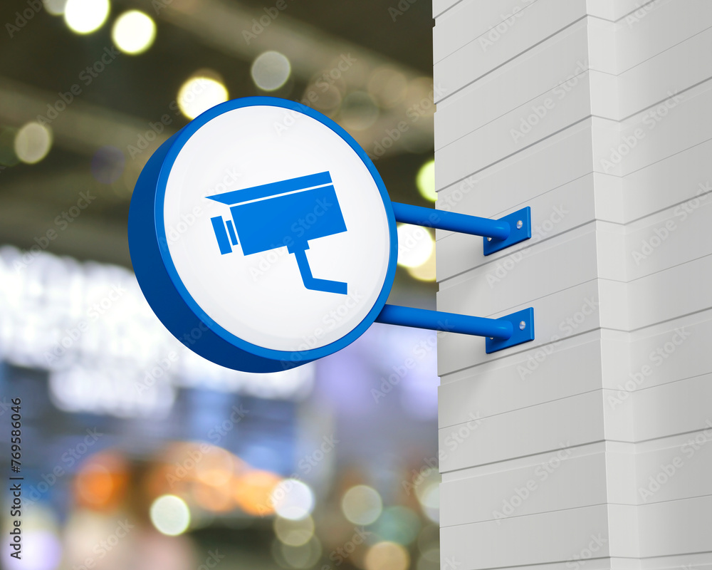 Cctv camera icon on hanging blue rounded signboard over blur light and ...