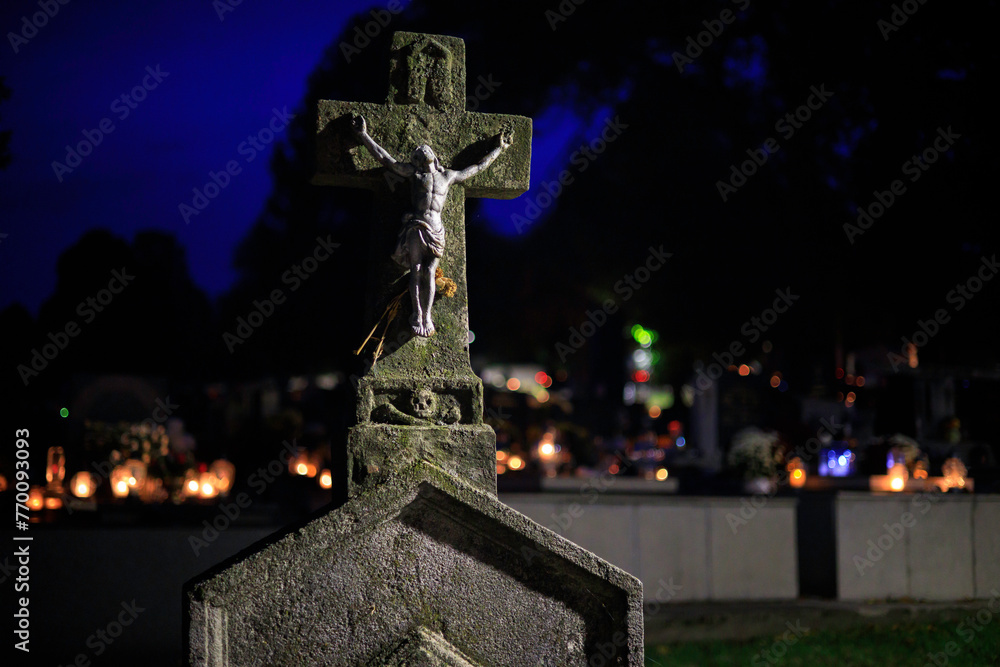 Crucified Jesus Christ on a stone cross in the cemetery, sacrificed ...