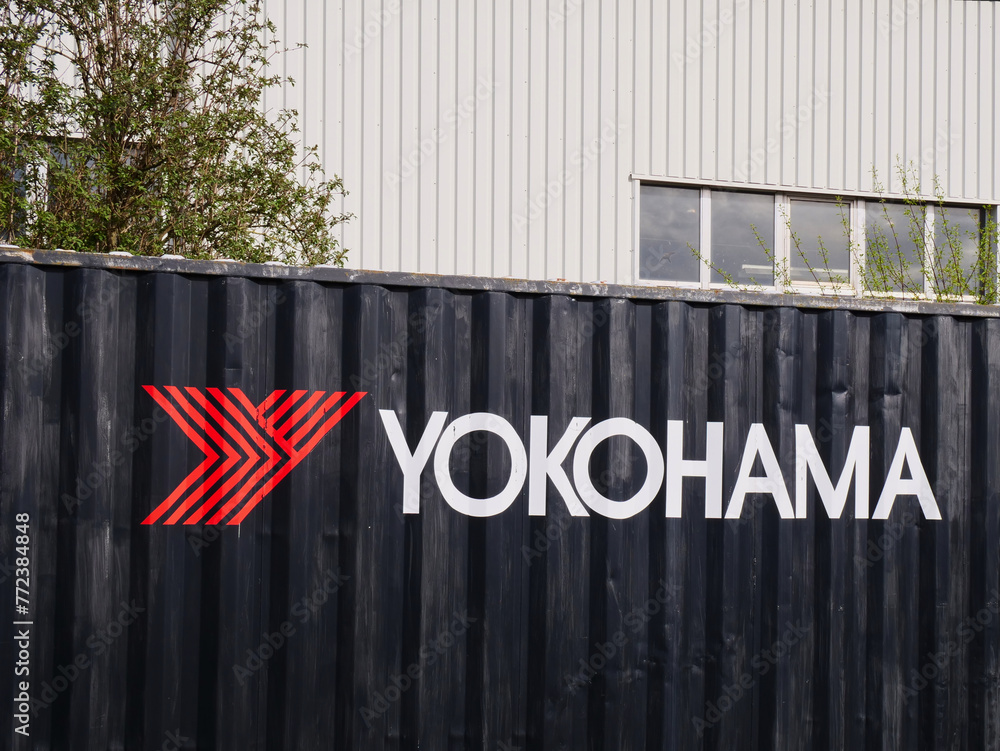 Yokohama logo on a black shipping container. Yokohama is a tire company ...