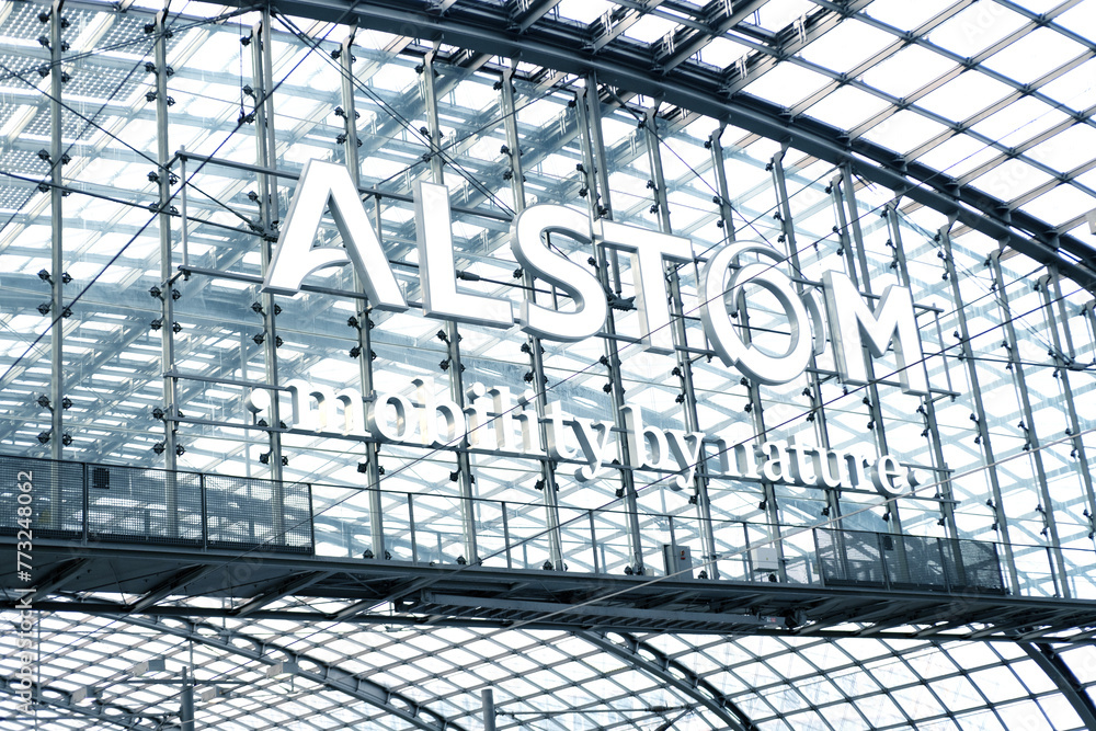 Alstom logo Company on arched metal vault at train station, French ...