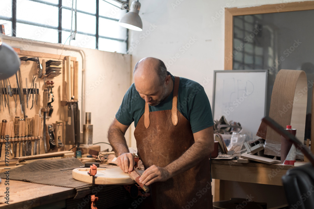 Luthier building a guitar Stock Photo | Adobe Stock