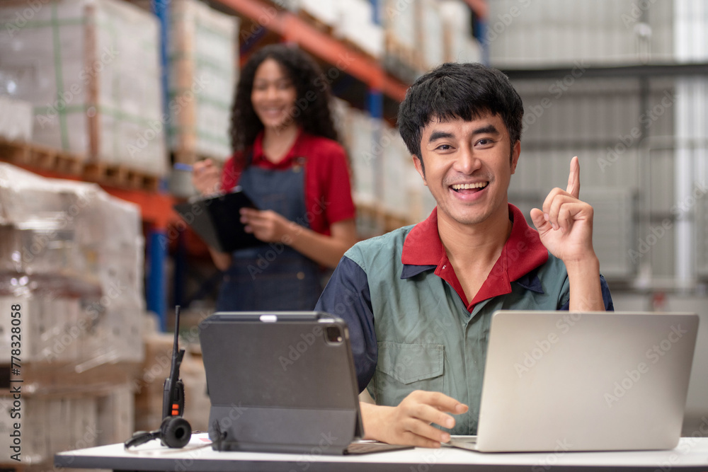 Male supervisor poses fingers pointing upwards like he had a good idea ...
