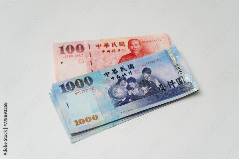 Taiwanese dollar banknote on white background Stock Photo | Adobe Stock