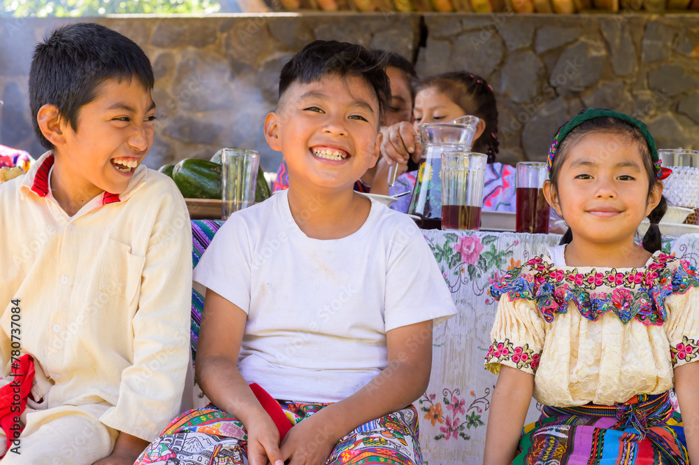 Group of 3 Mayan children, pose for a photo. Stock Photo | Adobe Stock